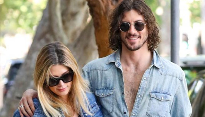 Delta Goodrem and Matthew Copley cuddle at BST Hyde Park